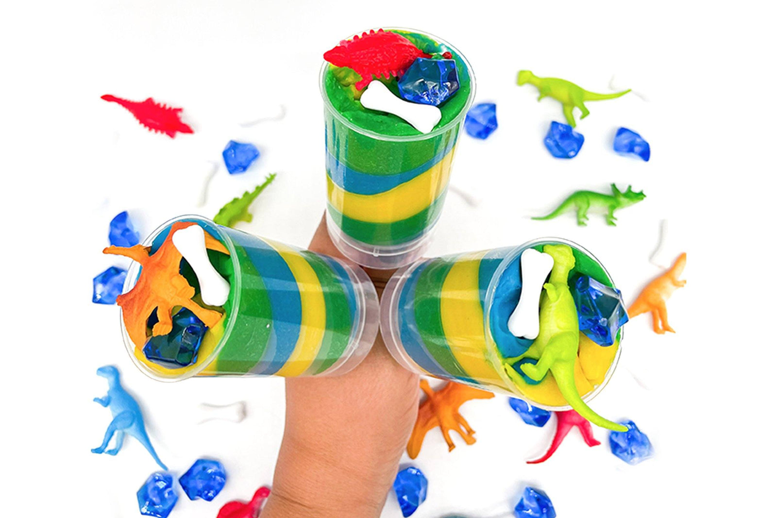 Dinosaur Sensory Dough Push Pop · Young + Wild and Friedman